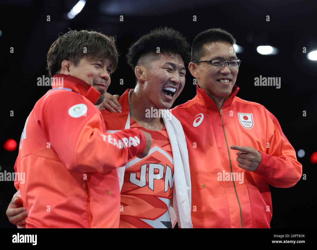 Japan's KUSAKA Nao (C) celebrates after winning the Men's Greco-Roman ...
