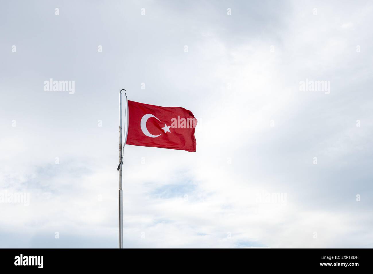 Turkish national flag hang on a pole in open air Stock Photo - Alamy