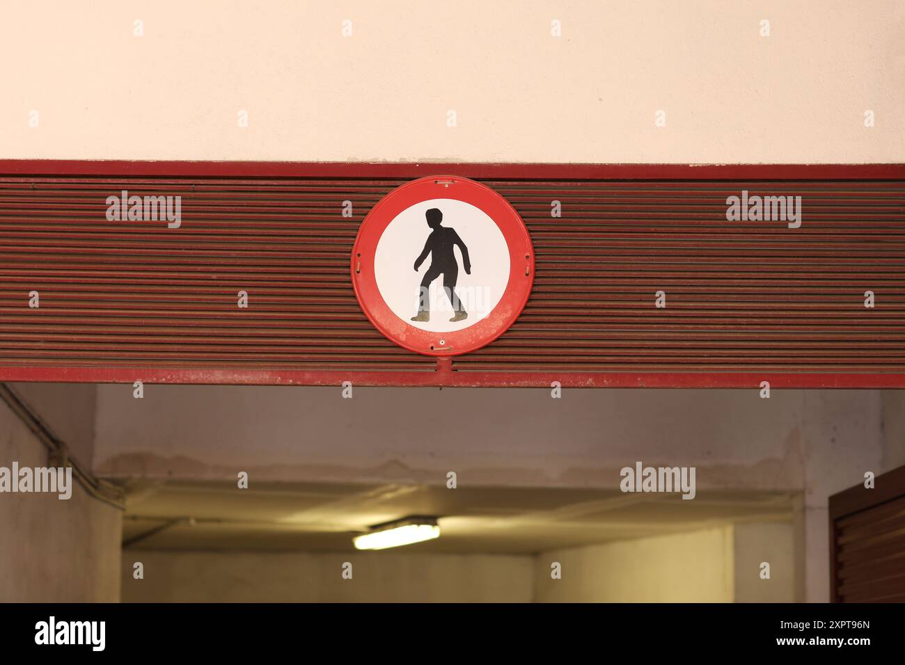 Prohibition sign. Pedestrian traffic is prohibited road sign, man in red circle on wall at ...