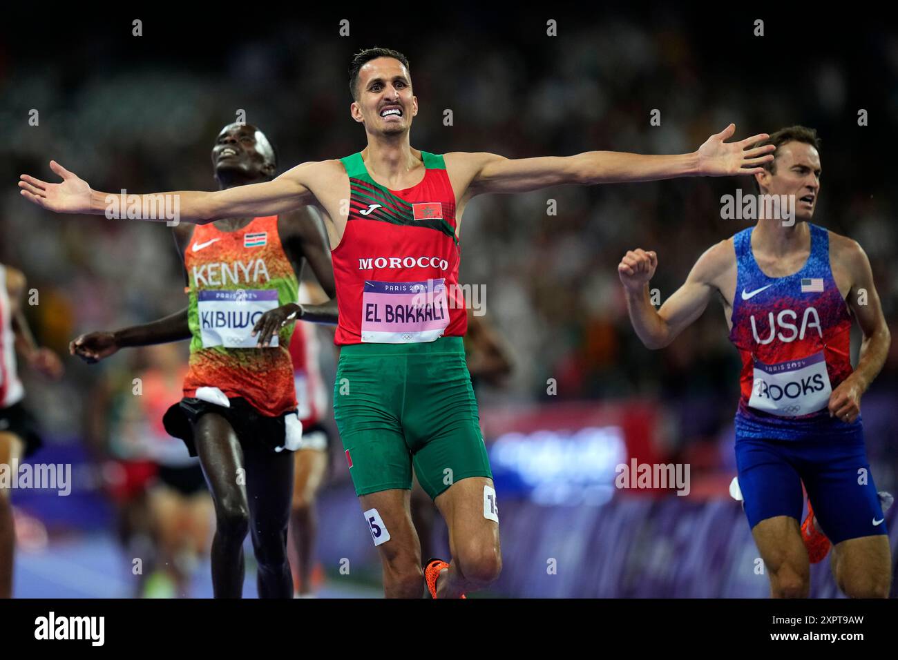 Soufiane El Bakkali, of Morocco, celebrates winning the men's 3000 ...