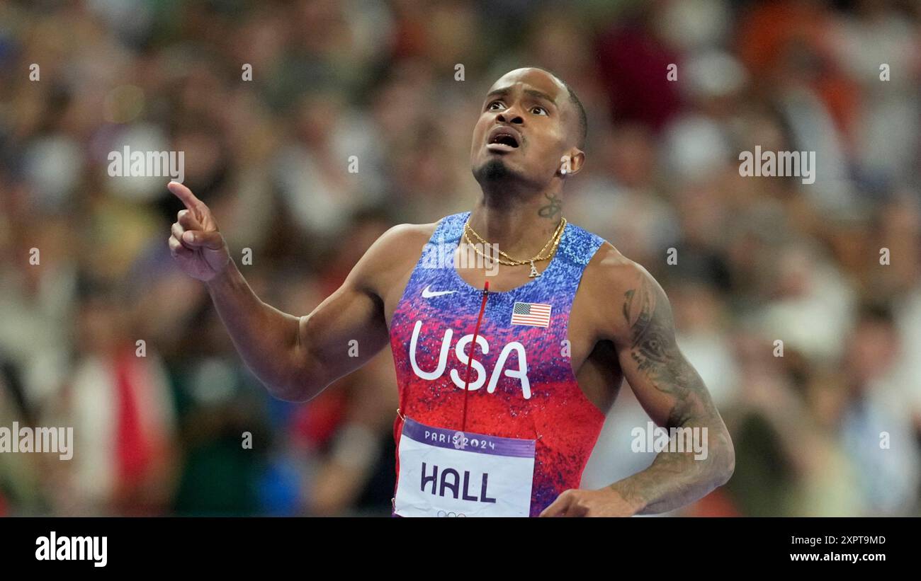 Quincy Hall, of the United States, looks up at the results after ...