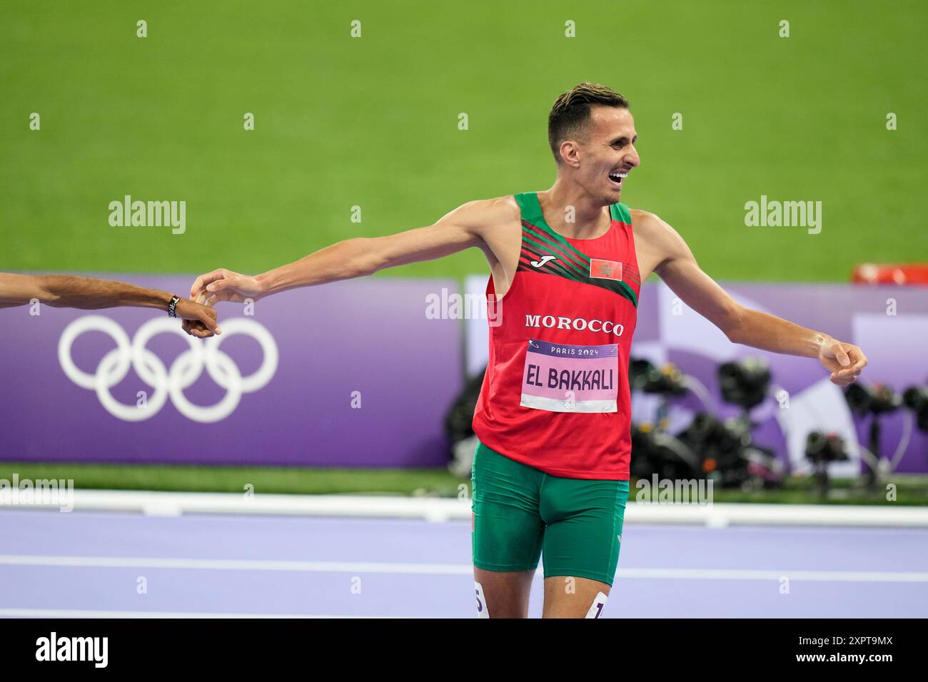 Soufiane El Bakkali, of Morocco celebrates after winning the men's 3000 ...