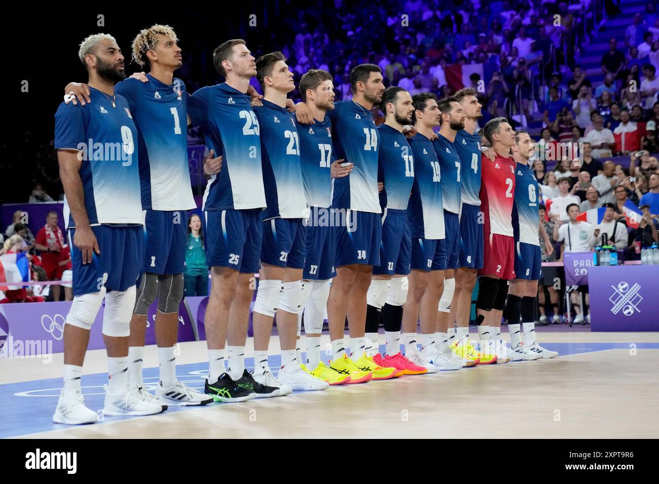 Members of the French team stand together after beating Italy in a ...