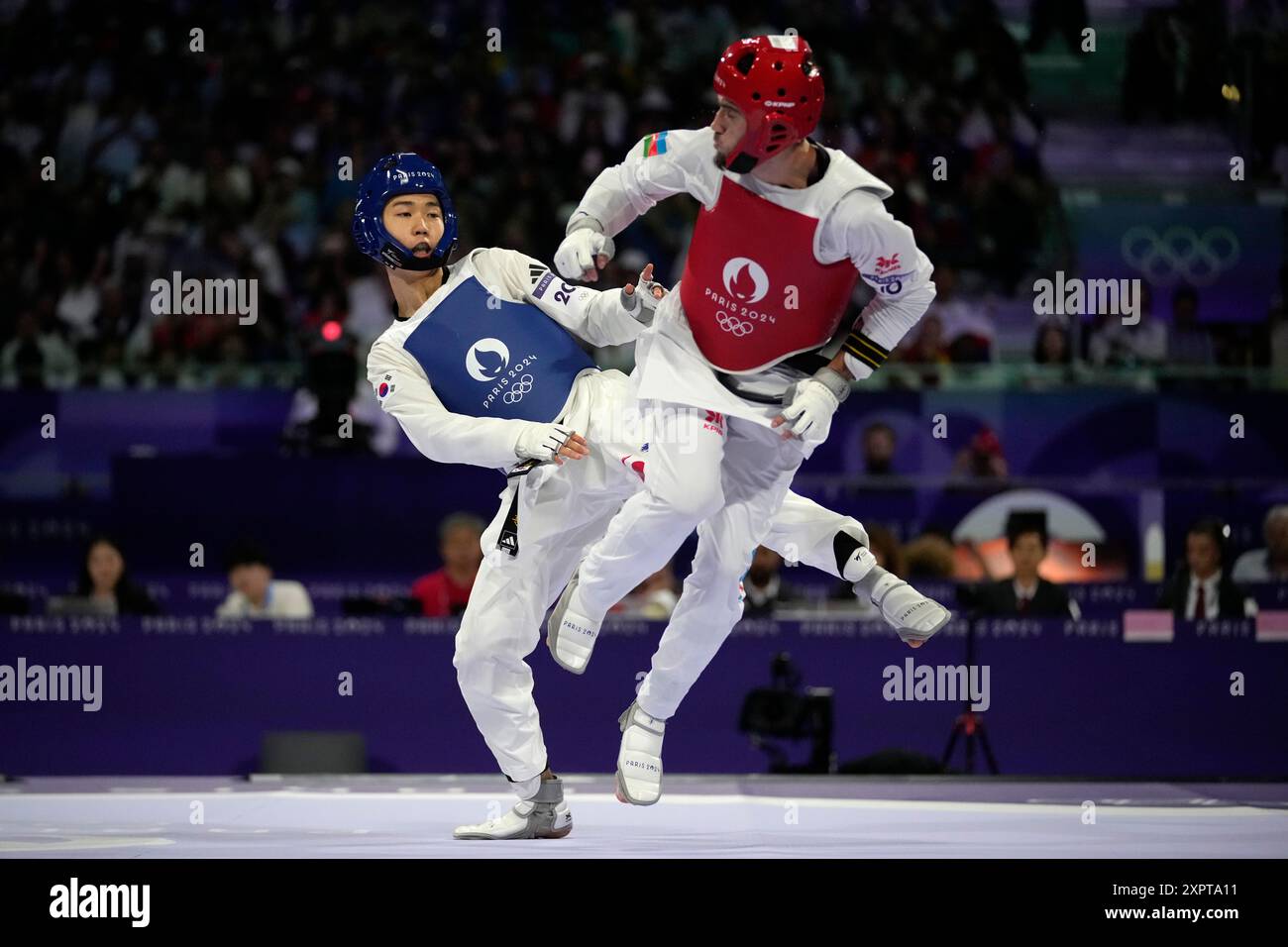 Korea's Taejoon Park competes with Azerbaijan's Gashim Magomedov in a ...