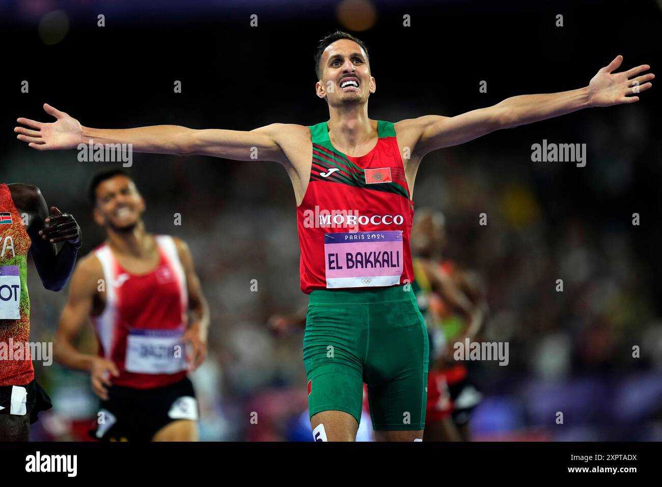 Soufiane El Bakkali, of Morocco, celebrates winning the men's 3000 ...