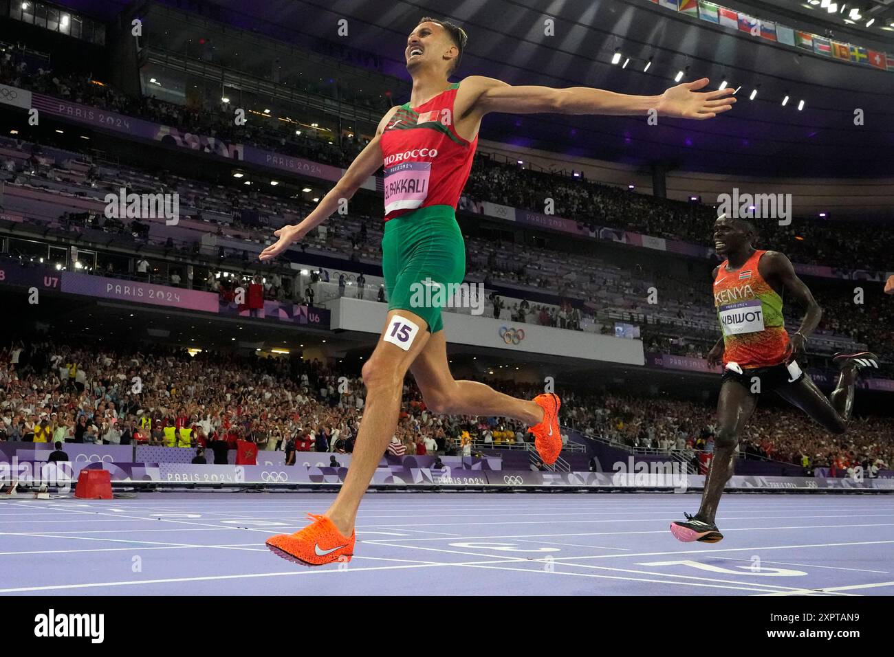 Soufiane El Bakkali, of Morocco, celebrates winning the men's 3000 ...