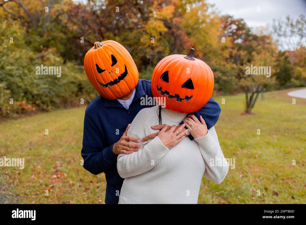 Fall date, pumpkin head photography, couples Stock Photo - Alamy