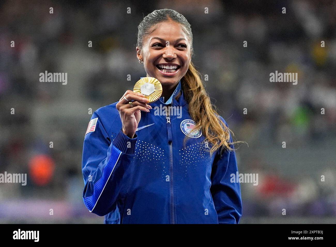 Gold medalist, Gabrielle Thomas, of the United States, stands on the ...
