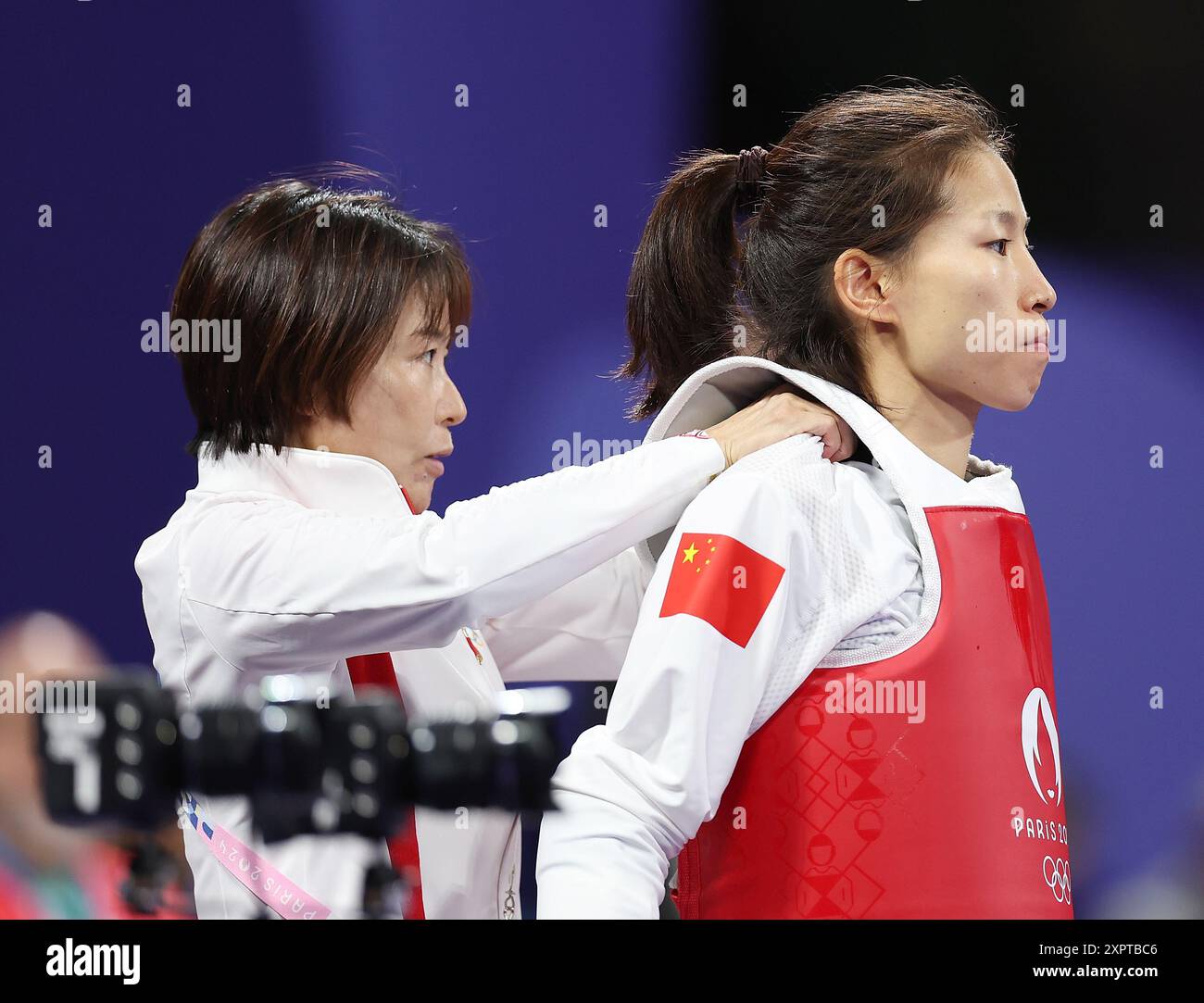 Paris, France. 7th Aug, 2024. Guo Qing (R) of China reacts during the women's 49kg gold medal ...