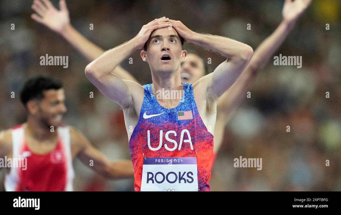 Kenneth Rooks, of the United States, reacts crossing the finish line to ...