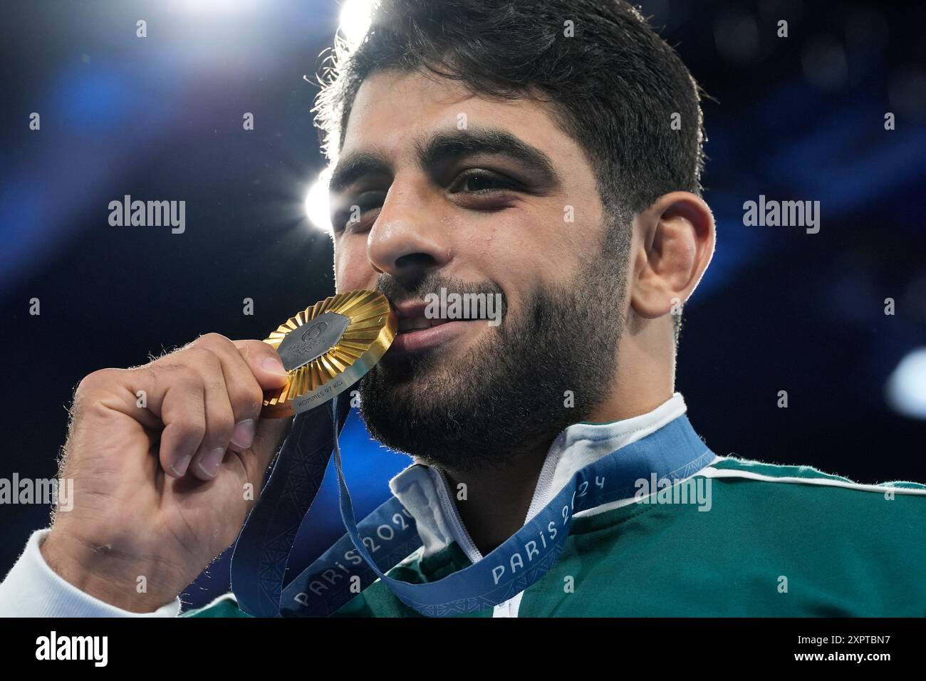 Iran's Mohammadhadi Saravi celebrates with his gold medal during the ...