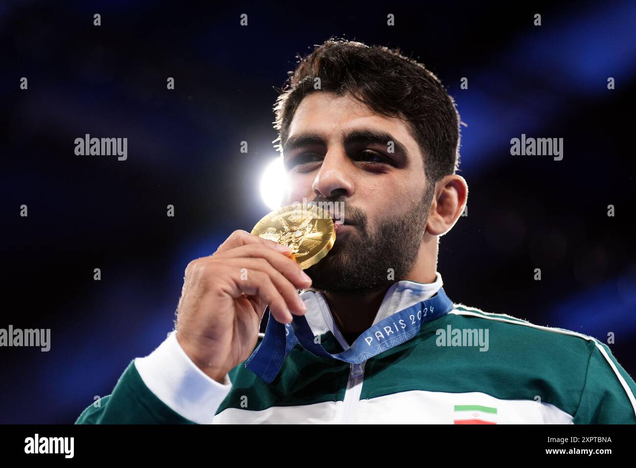 Iran's Mohammadhadi Saravi receives his gold medal for the Men's Greco ...