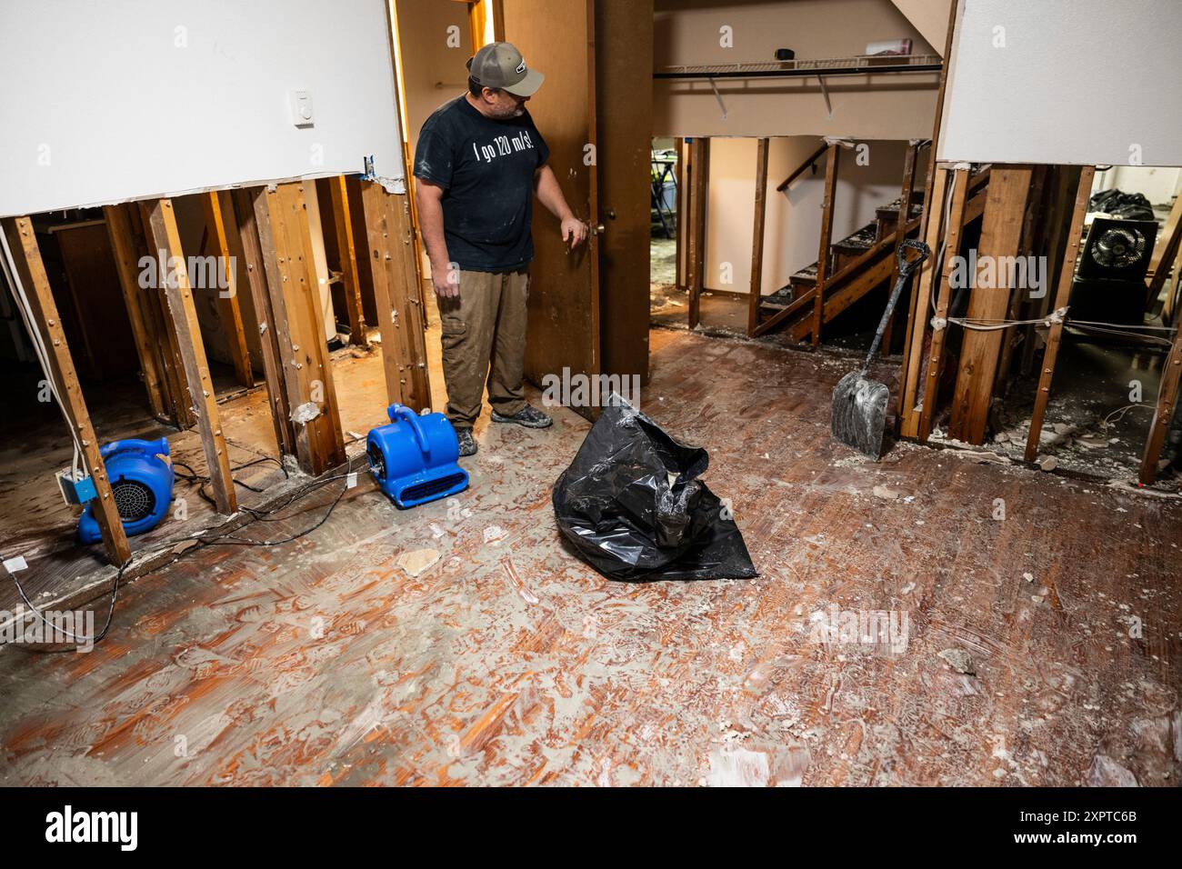 Jason Nardi spent much of the day removing wet drywall and insulation ...