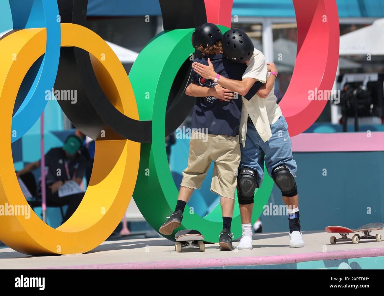 Carew Tate of the US hugs compatriot Gavin Bottger in congratulations ...