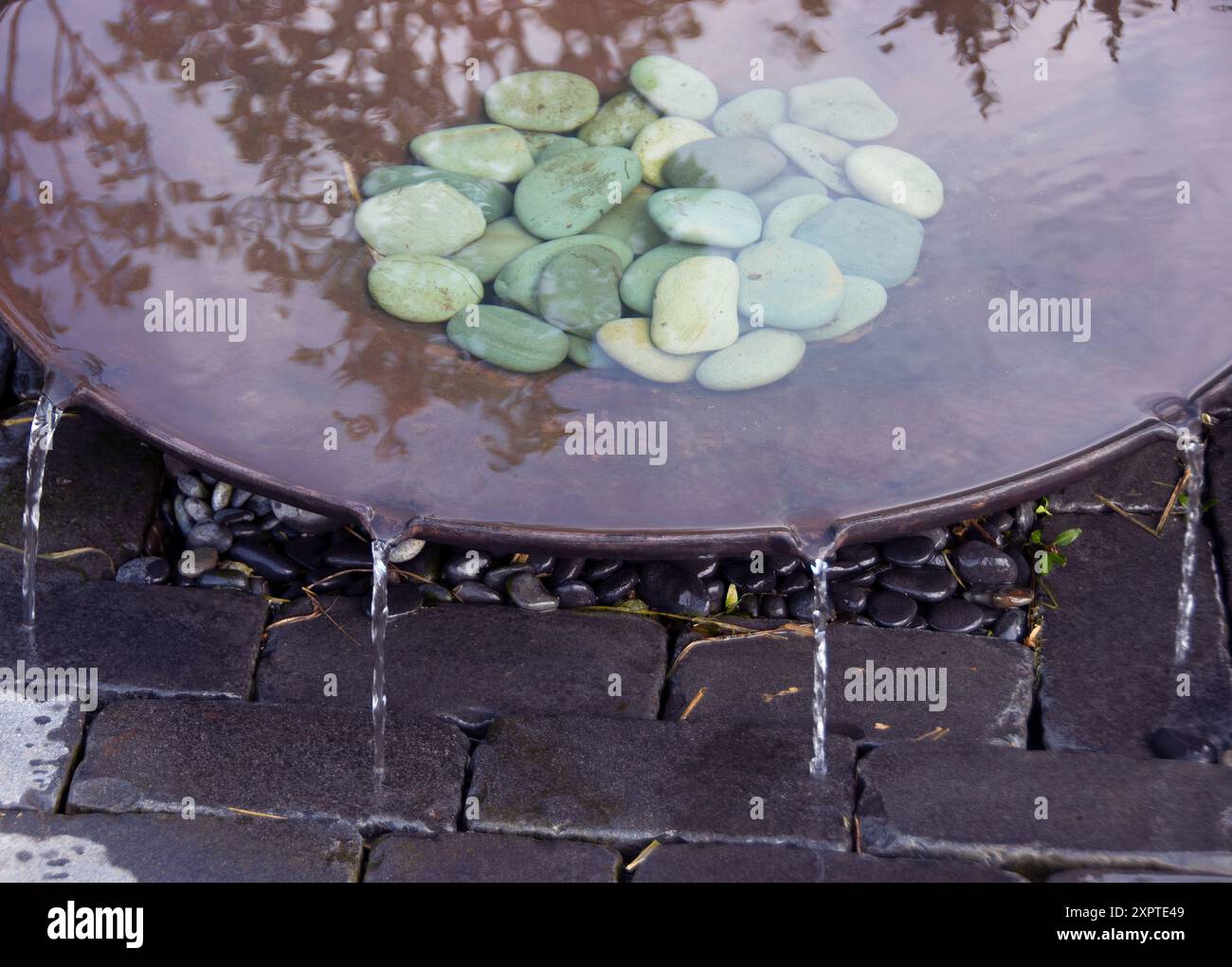 Contemporary copper water feature Stock Photo - Alamy