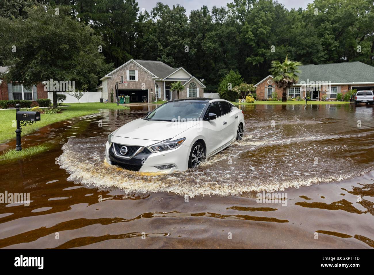 Keon Johnson leaves his house on his way to work down a street that ...