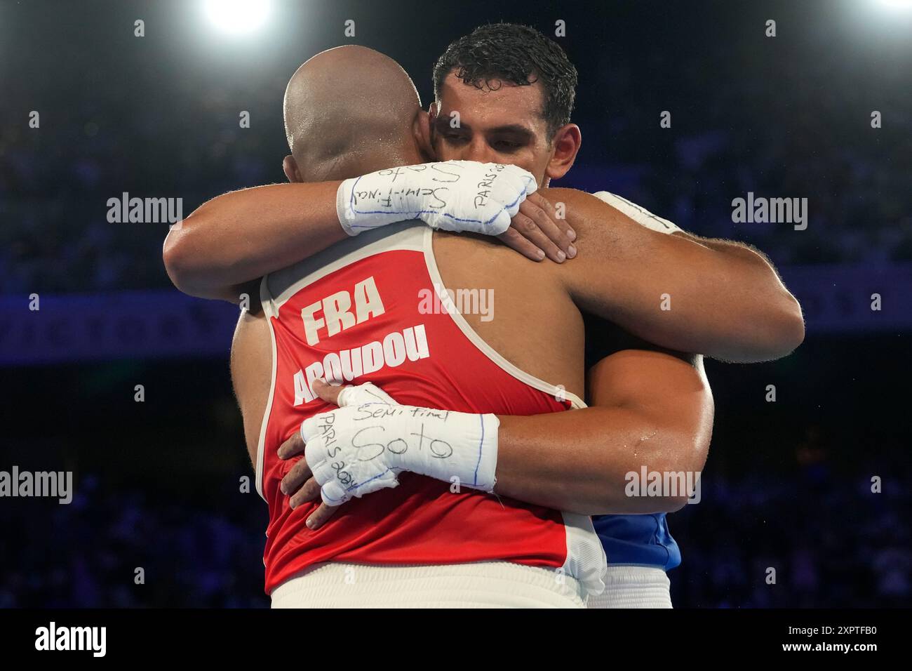 France's Djamili-Dini Aboudou embraces Spain's Ayoub Ghadfa after ...