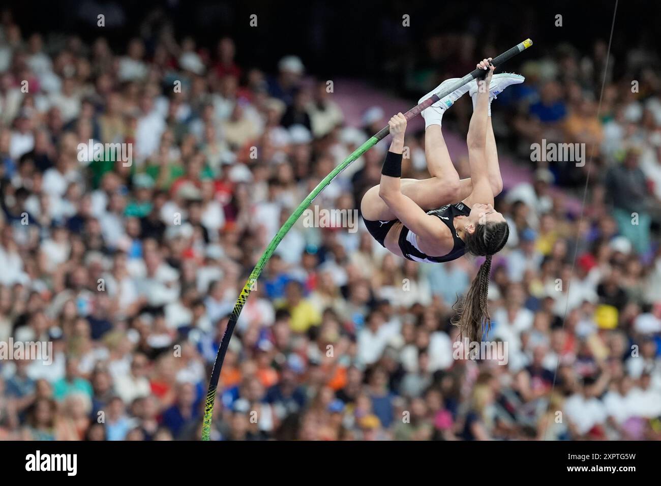 Eliza McCartney, of New Zealand, competes in the women's pole vault ...
