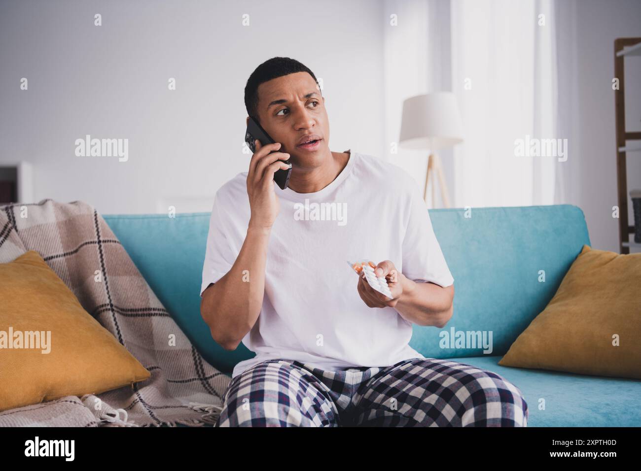Photo of depressed sad guy nightwear pajama having rest couch talking ...