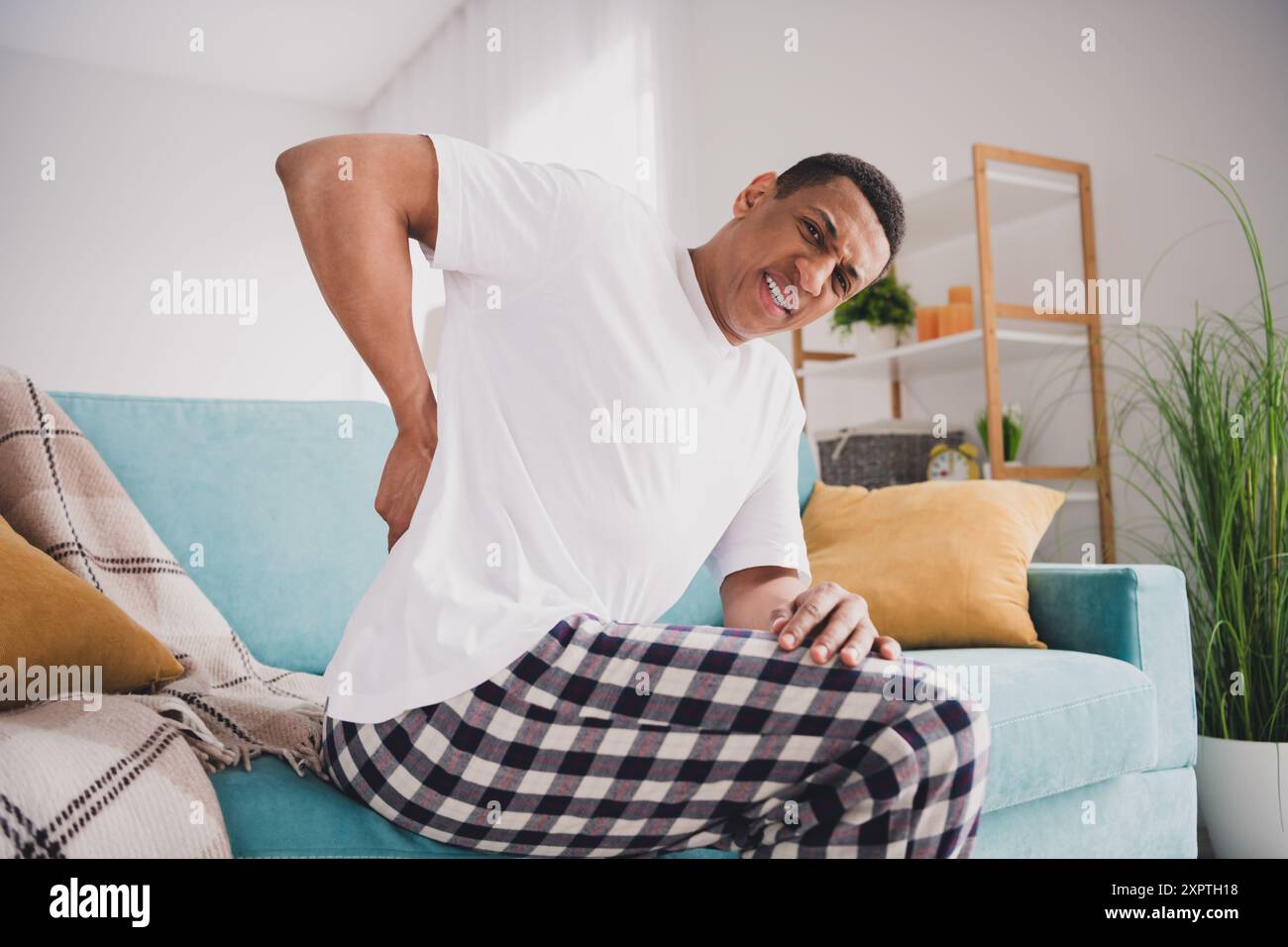 Photo of depressed sad guy nightwear pajama feeling backache having ...