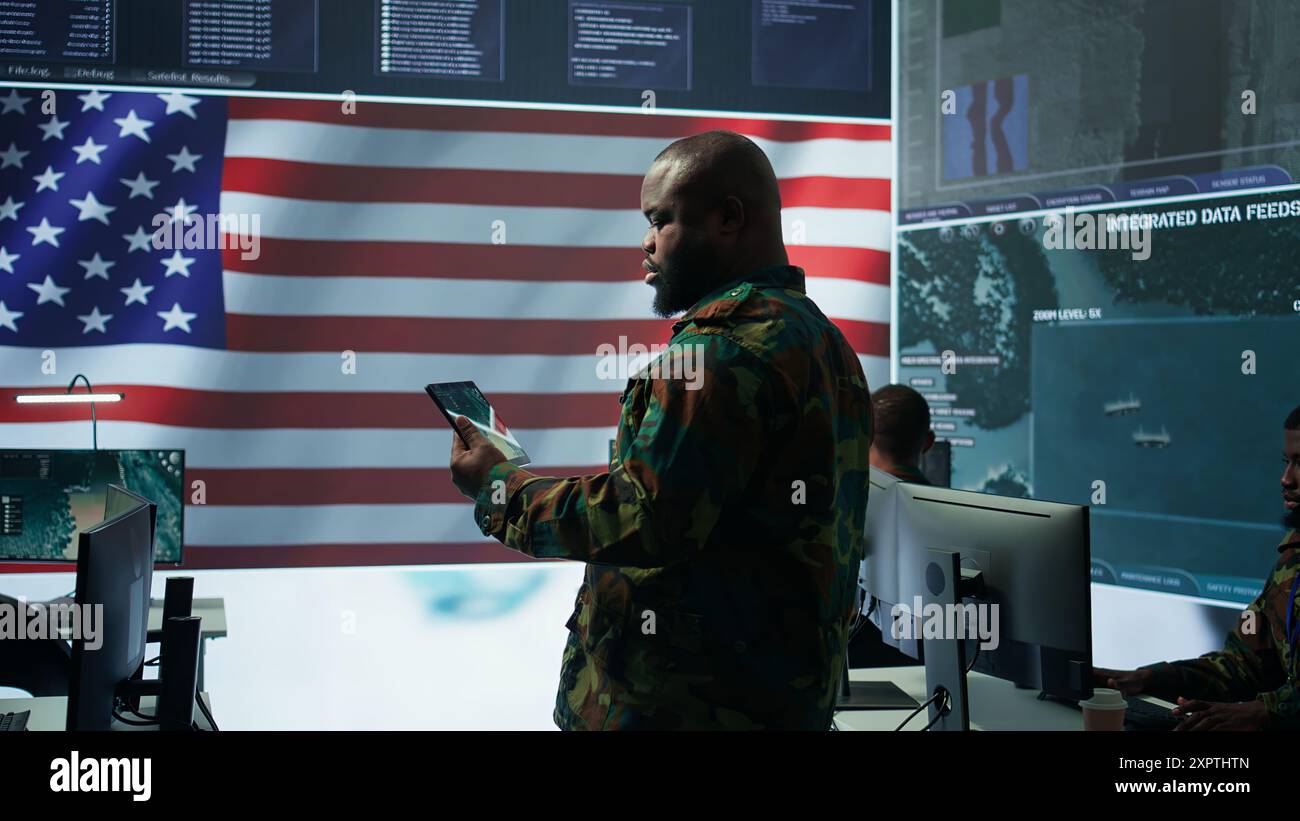 American military intelligence officers in a command center monitoring ...