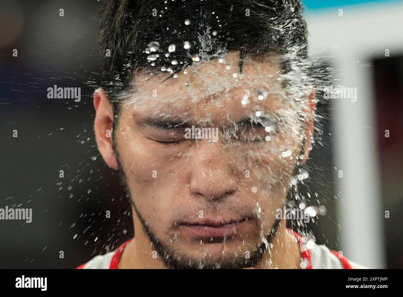 Kazakhstan's Nurbek Oralbay gets water splashed on him ahead of fighting Ukraine's Oleksandr ...