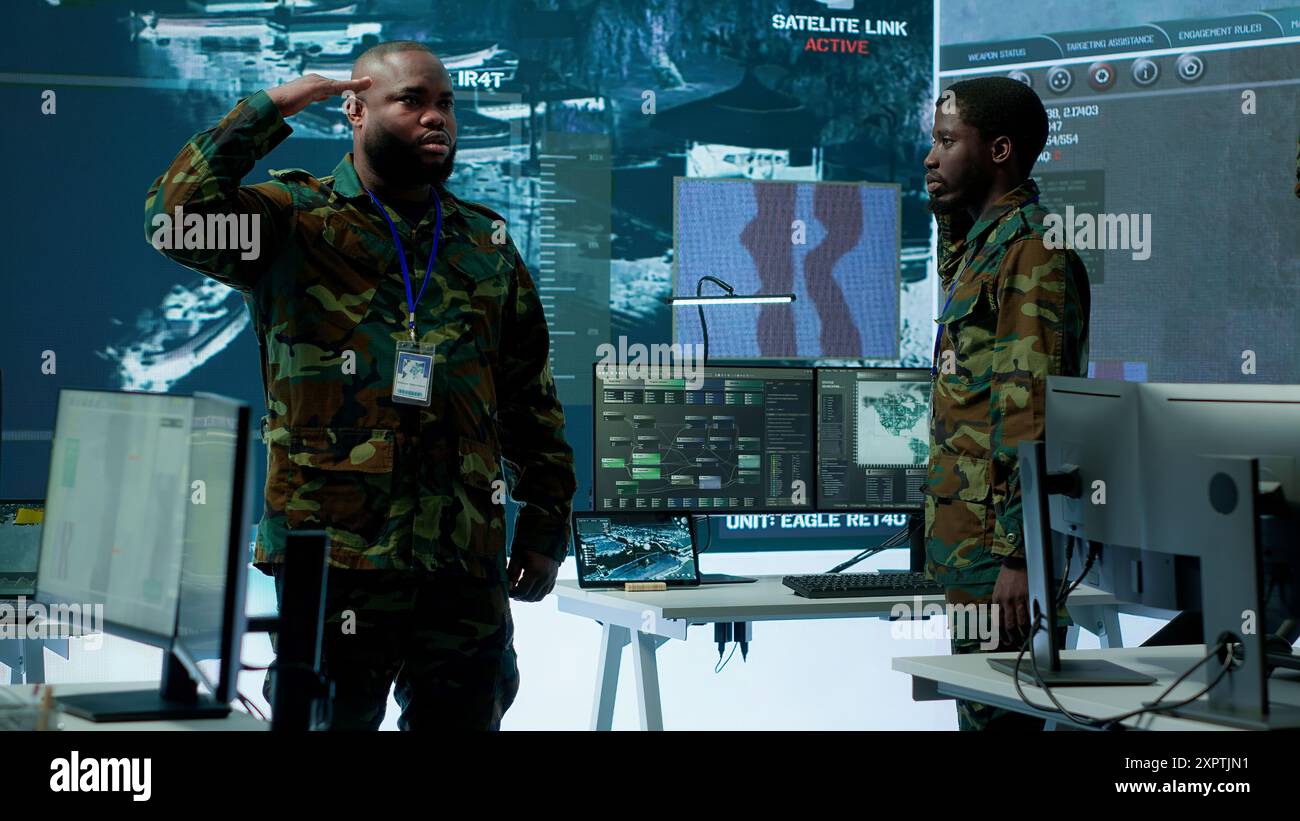 Military personnel operate advanced systems in a command center ...