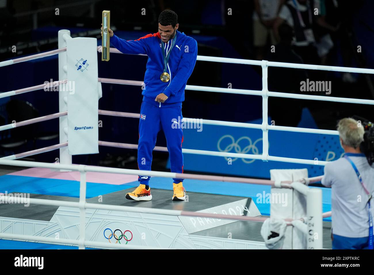 Cuba's Erislandy Alvarez Borges poses on the podium with the gold medal ...