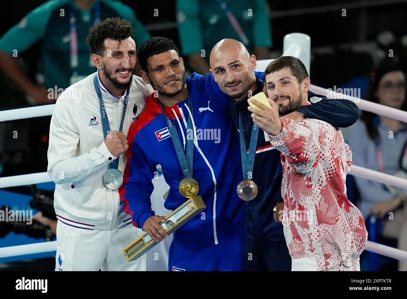Silver medalist France's Sofiane Oumiha, left, gold medalist Cuba's Erislandy Alvarez Borges ...