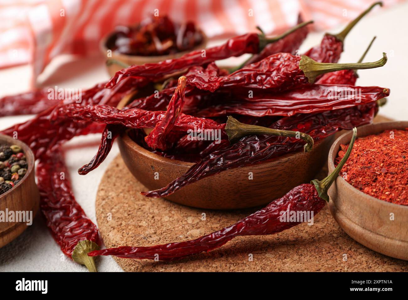 Composition with dry hot chili peppers and spices on white background ...