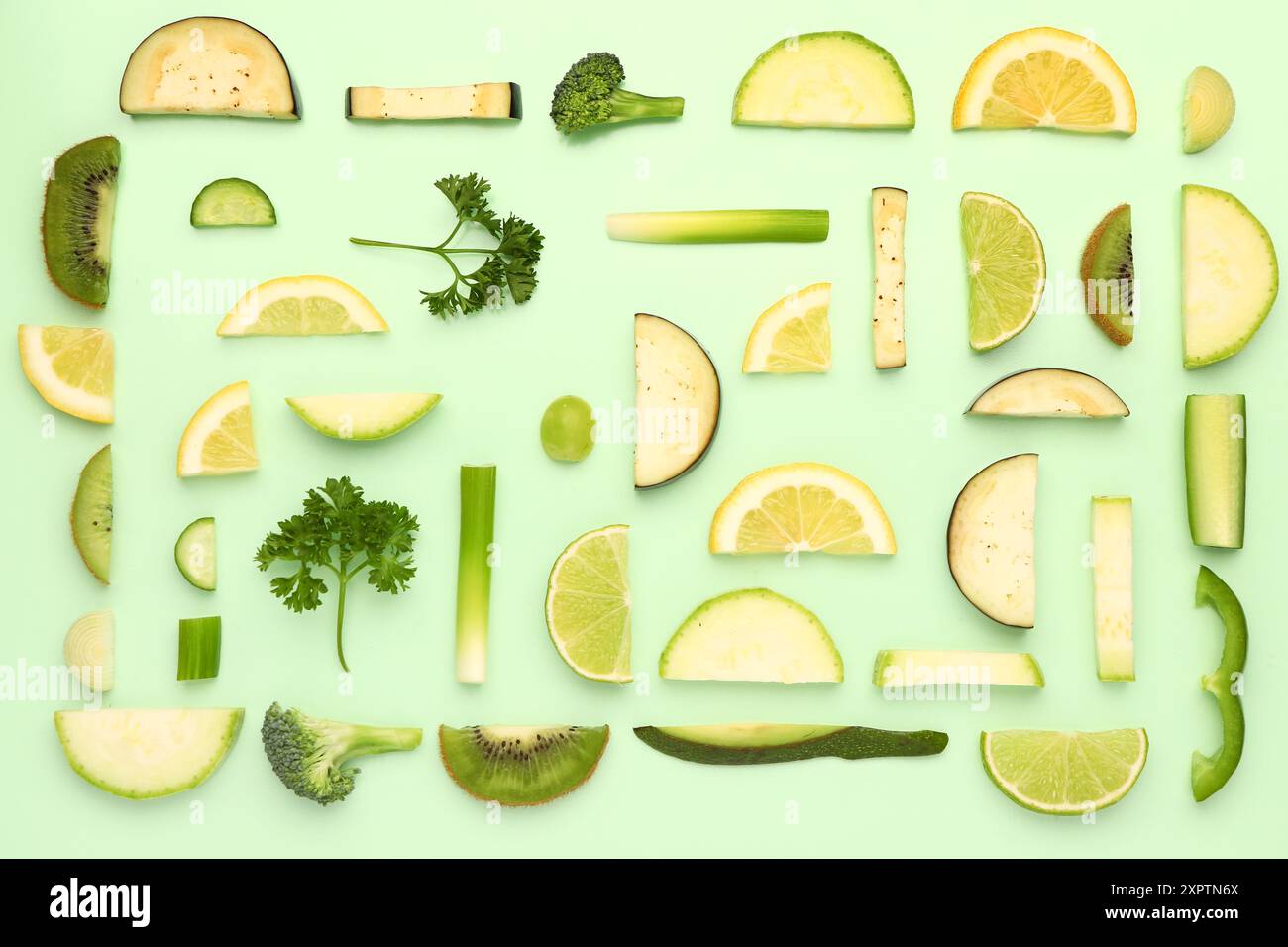 Composition with different fresh green vegetables and fruits on pale ...