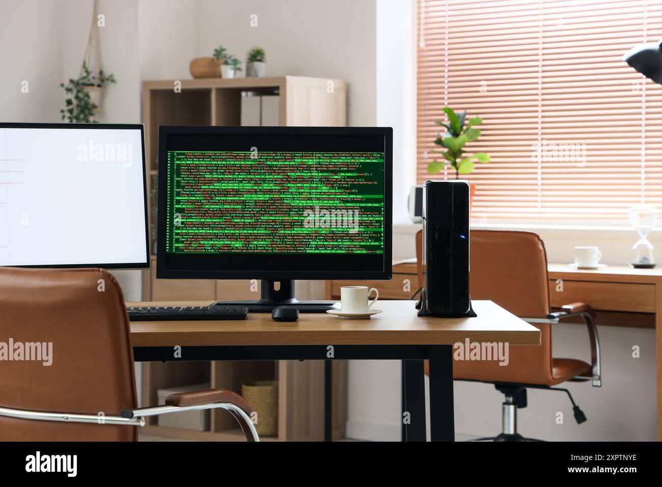 Modern workplace of programmer with double monitor in stylish office ...