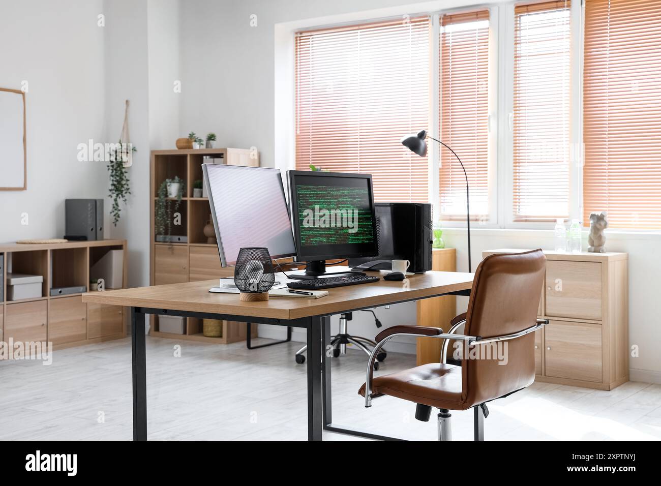 Modern workplace of programmer with double monitor in stylish office ...