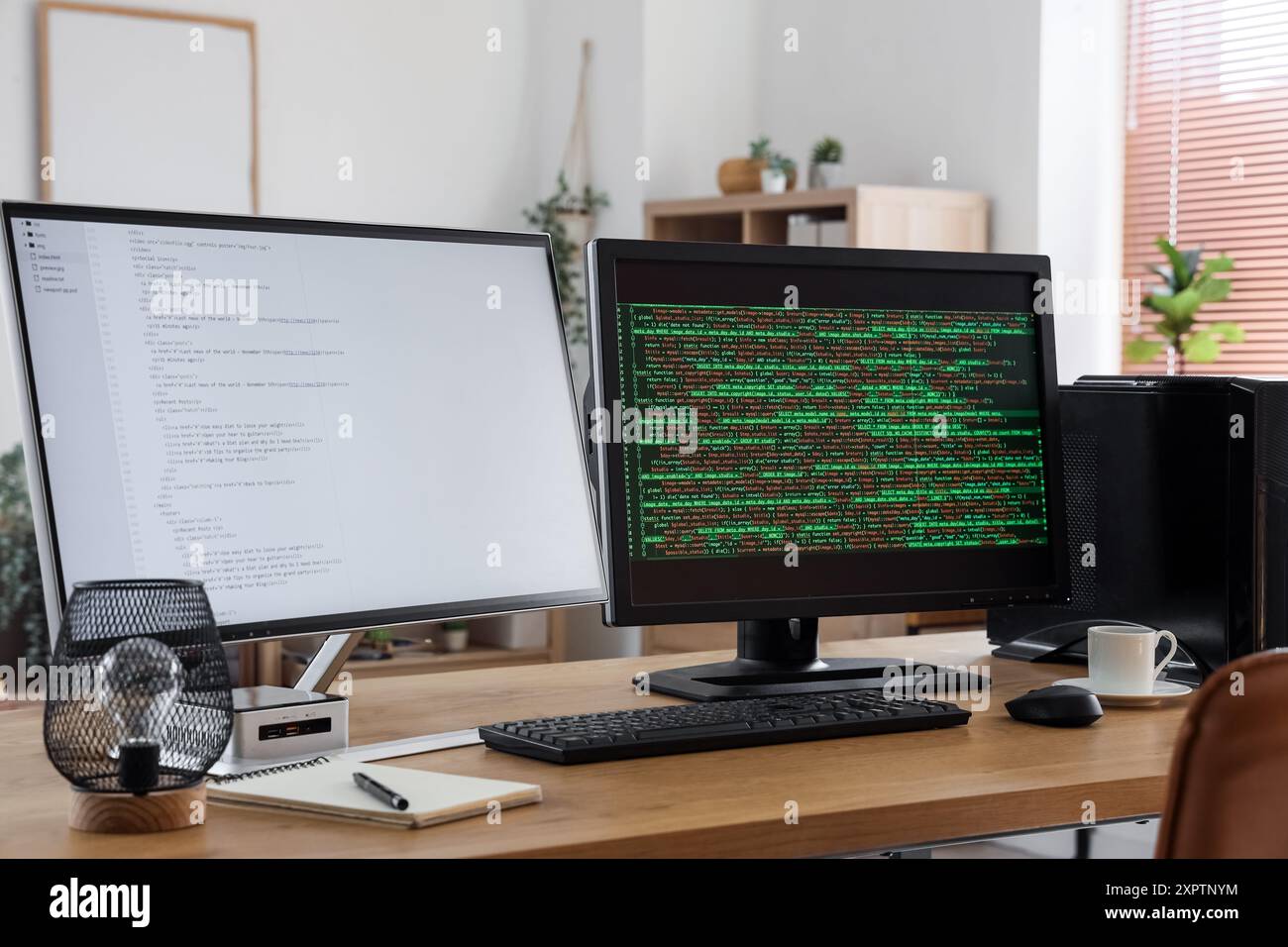 Modern workplace of programmer with double monitor in stylish office ...