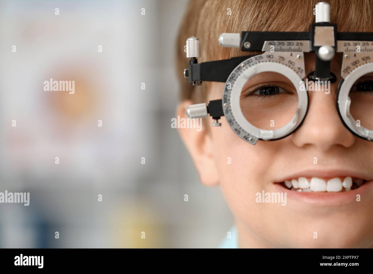 Little boy with optical trial frame in clinic, closeup Stock Photo - Alamy