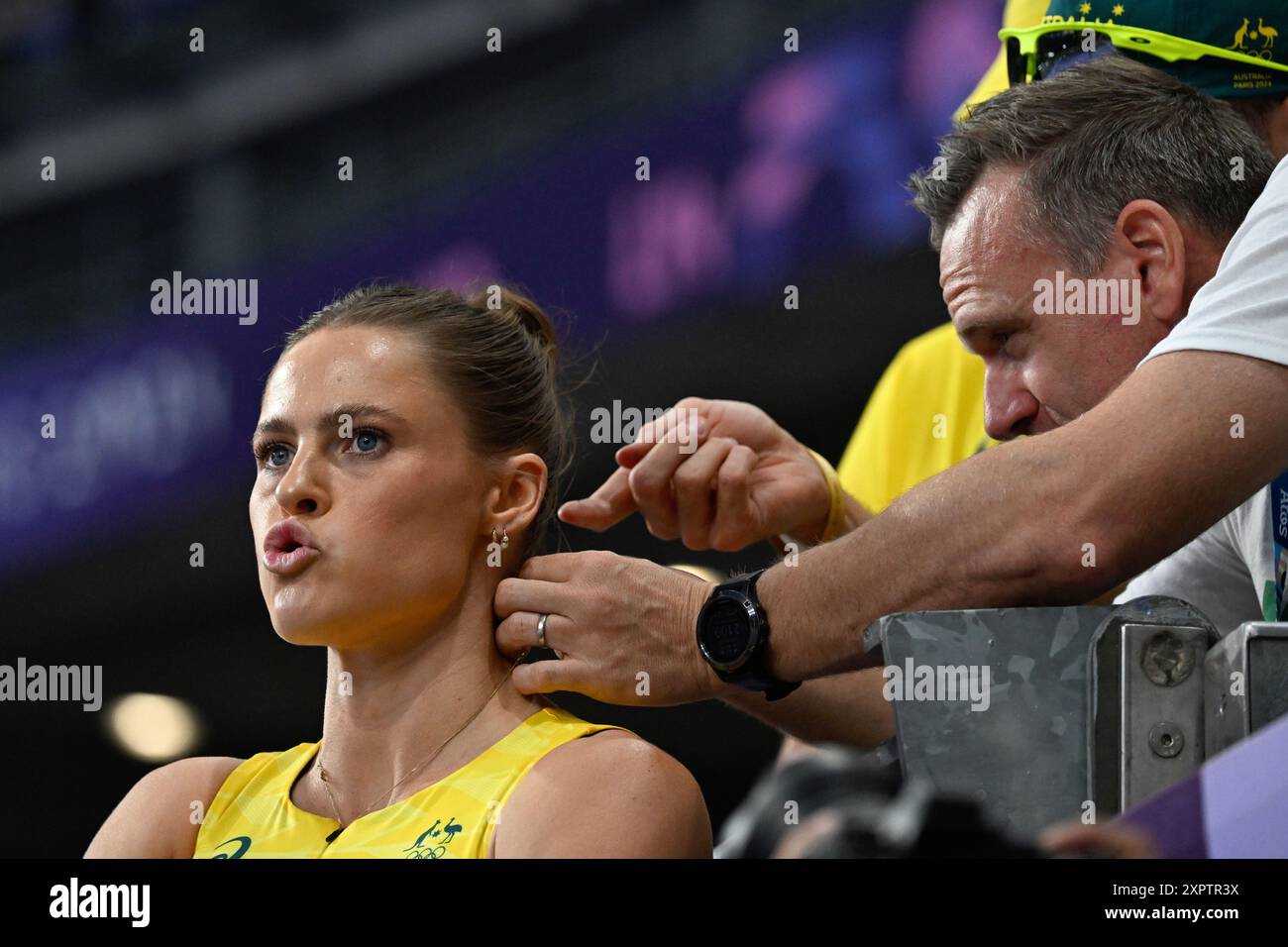 Saint Denis, France. 07th Aug, 2024. Australian pole vaulter Nina Kennedy's team untangle her ...