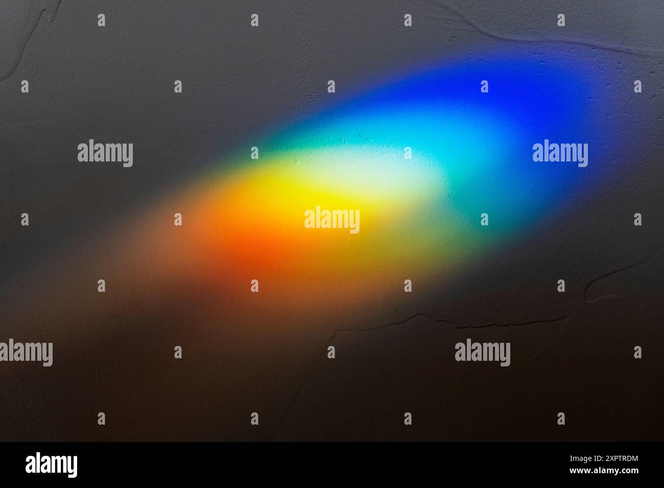 Refracted sunlight through stained glass window creates a prism of ...