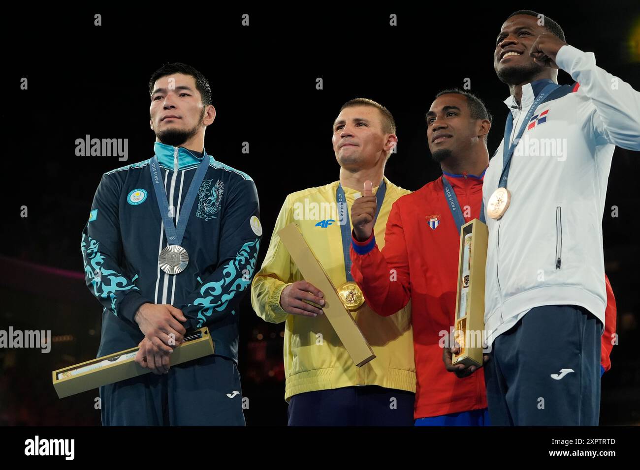 Silver medalist, from left, Kazakhstan's Nurbek Oralbay, gold medalist ...