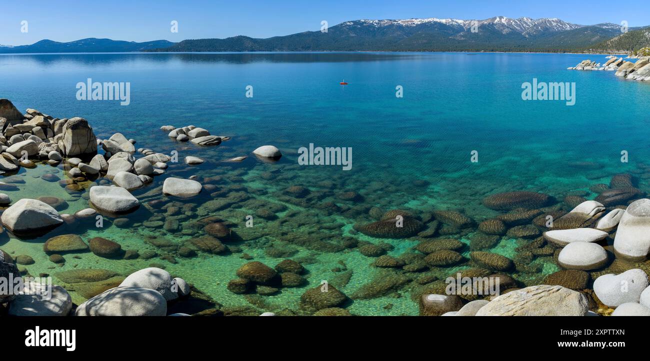 Crystal Rocky Lake - A panorama of crystal-clear water at a rocky cove ...
