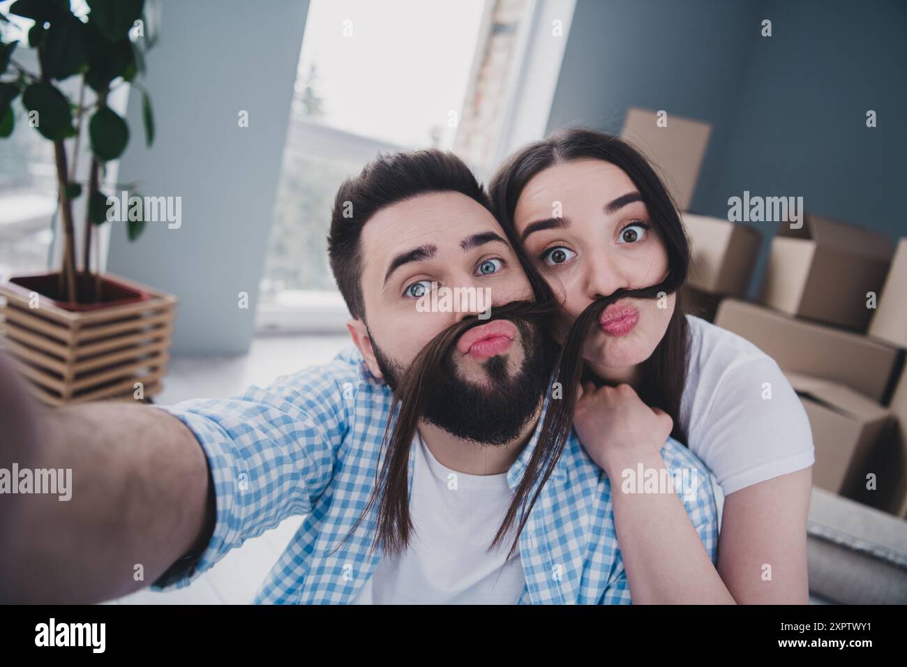 Portrait of two young people hug hair mustache make selfie relocating ...