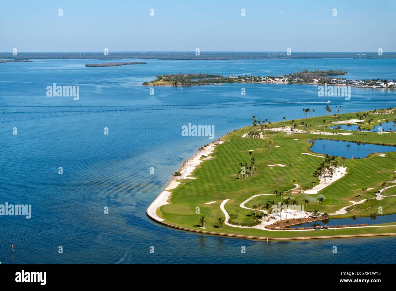 Aerial view of large golf course with green grass in Boca Grande in ...