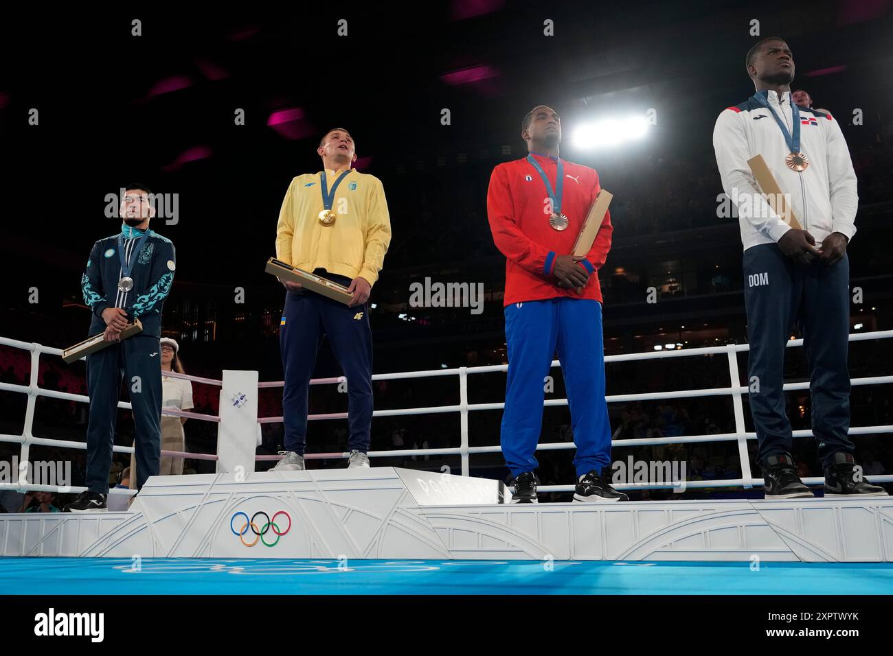 Silver medalist, from left, Kazakhstan's Nurbek Oralbay, gold medalist ...