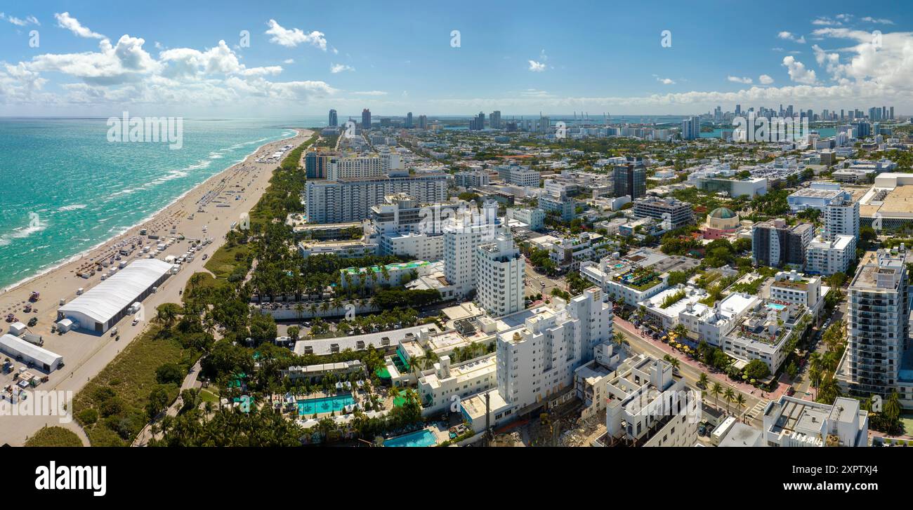 Aerial view of South Beach sandy surface with tourists relaxing on hot ...