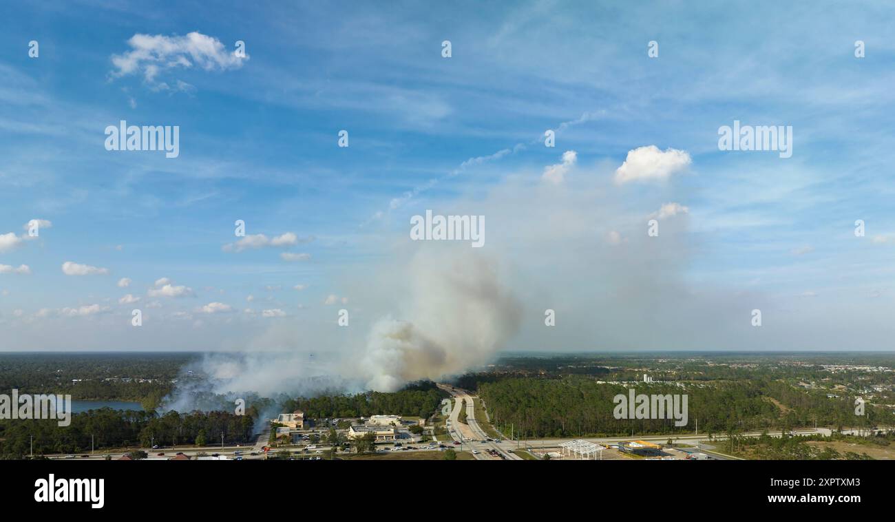 Aerial view of strong wildfire burning severely in North Port city ...