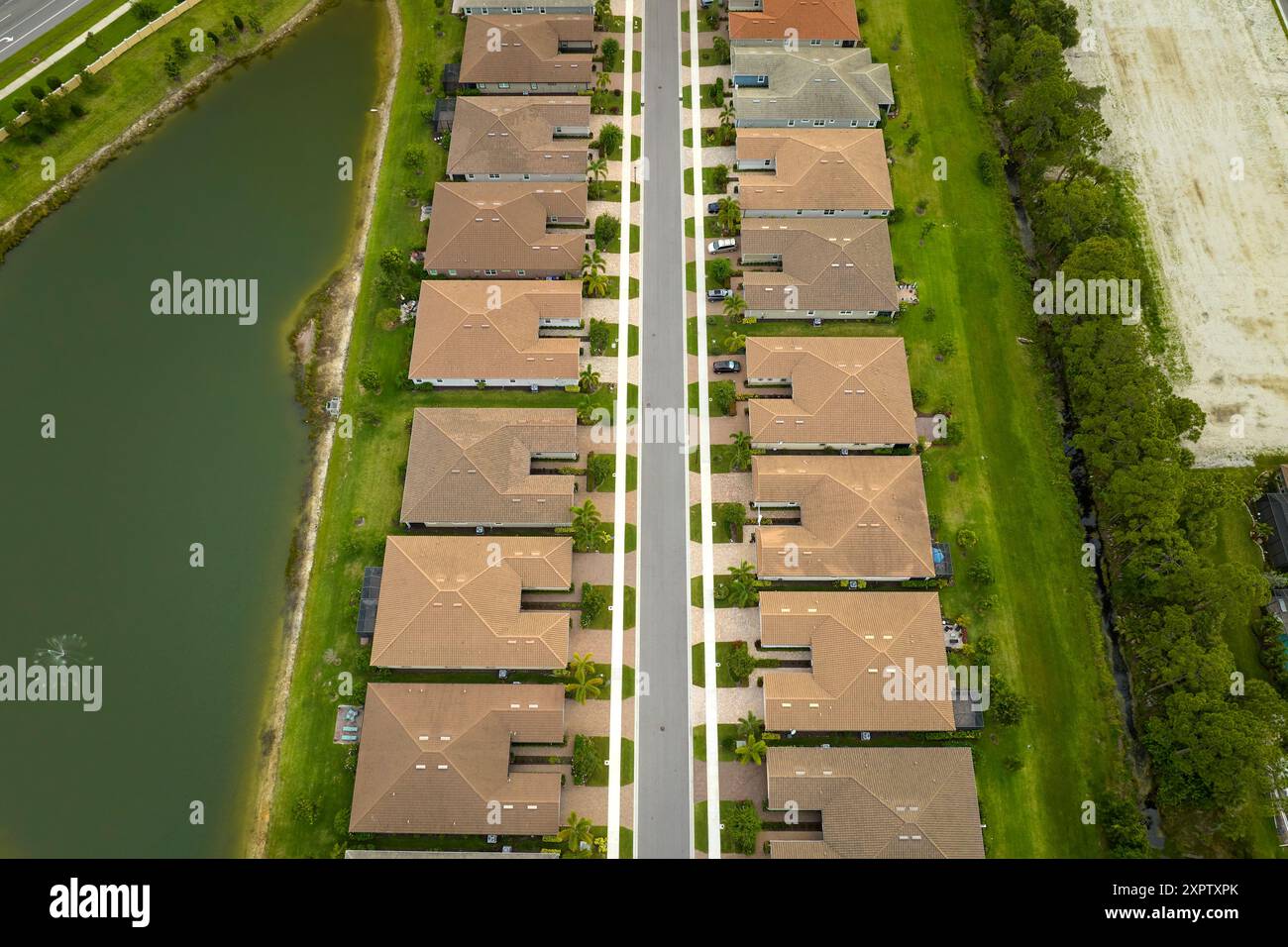 Aerial view of tightly located family houses in Florida closed suburban ...
