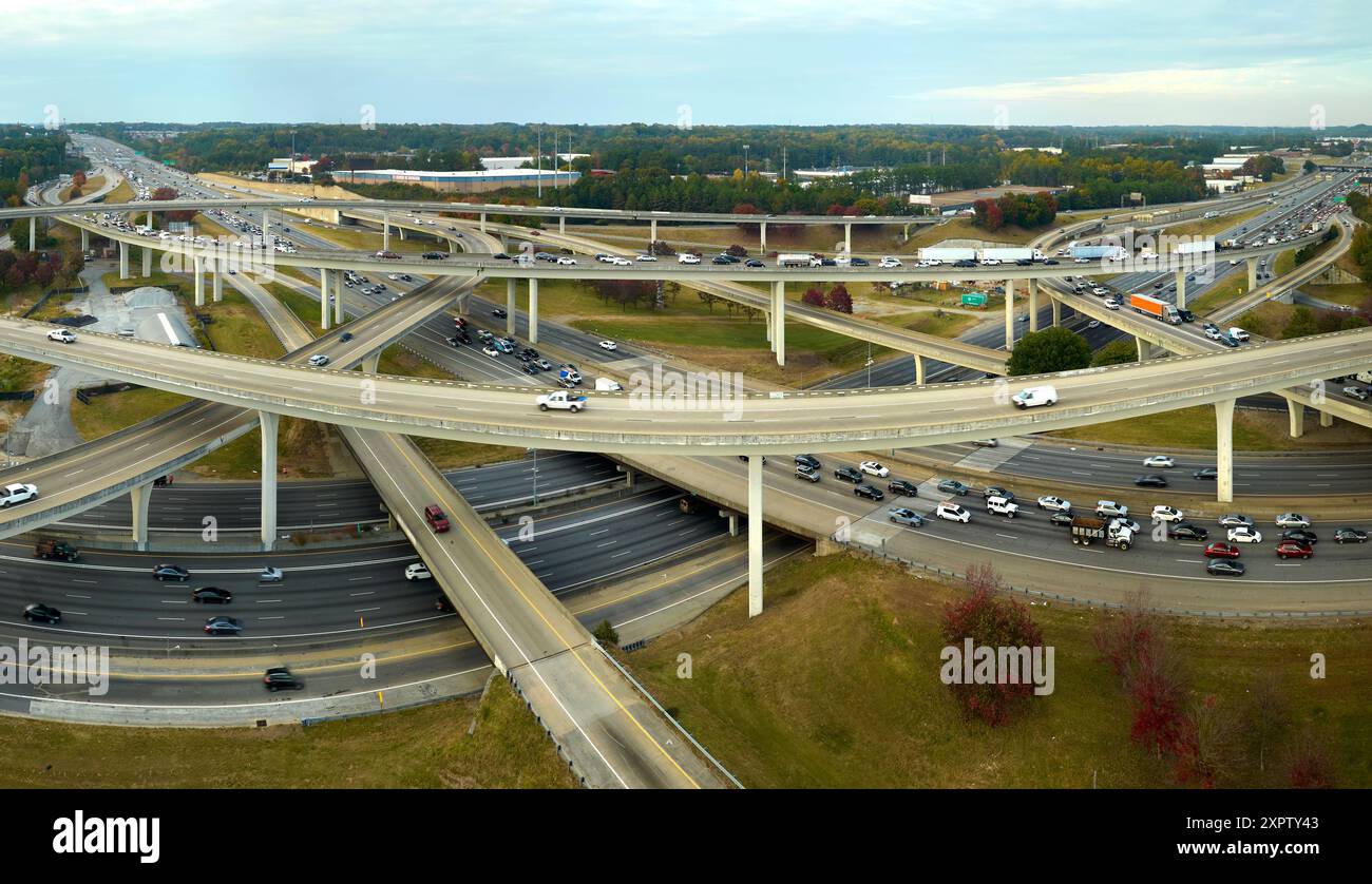 American freeway intersection with fast driving cars and trucks. View ...