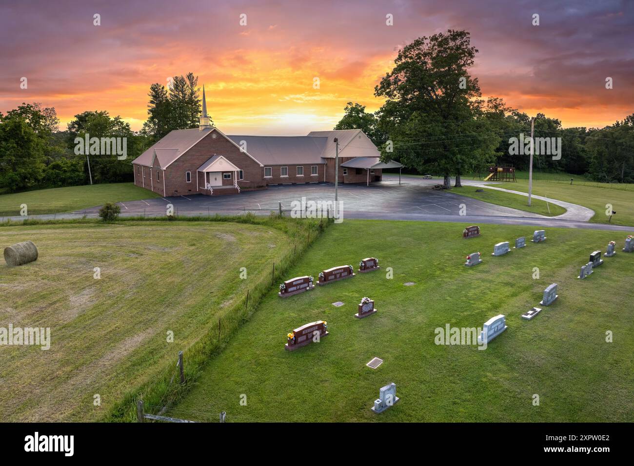 Church graveyard with many tombstones in small American town. Burial ...