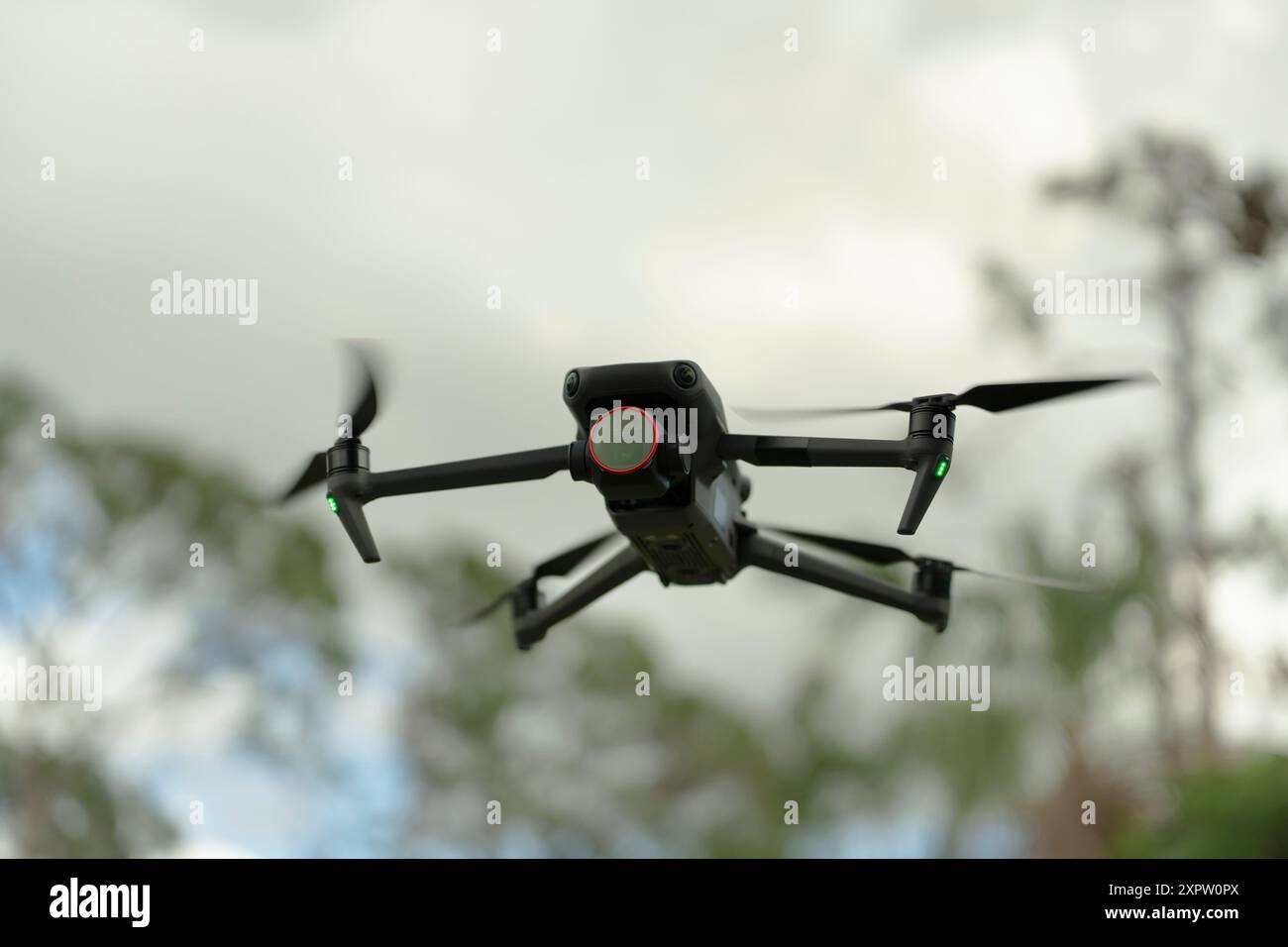 Drone quadcopter with digital camera and fast rotating propellers ...