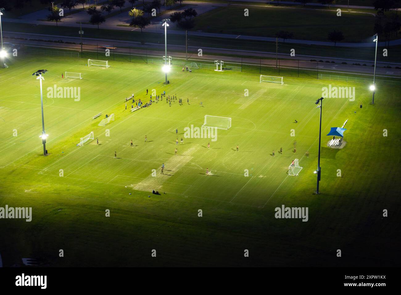 People playing football park aerial hi-res stock photography and images ...