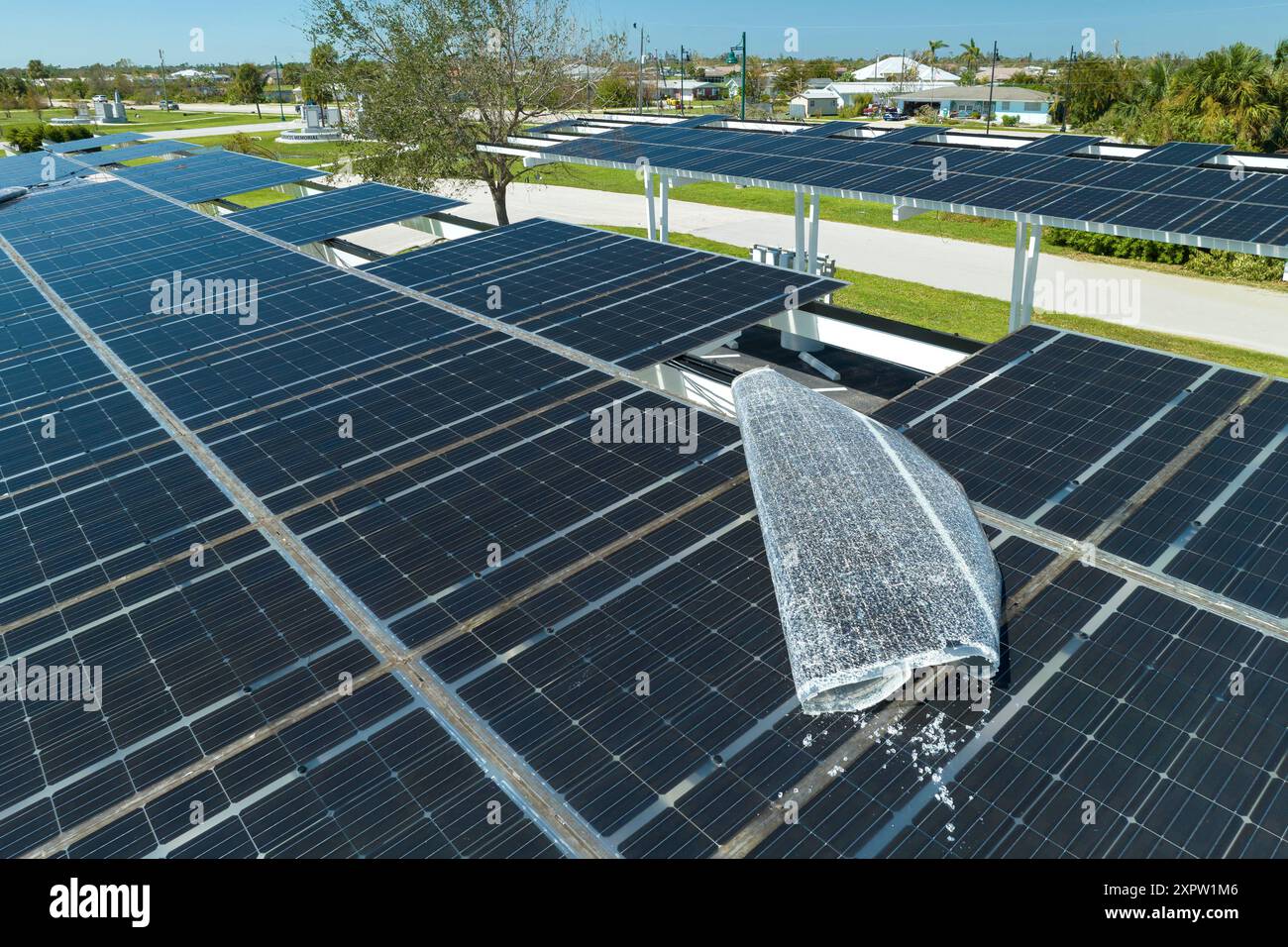 Hurricane wind damage to solar panels installed as shade roof over ...